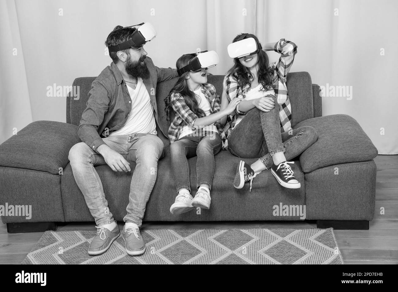 happy parents with kid girl use modern technology. mom dad and daughter ...