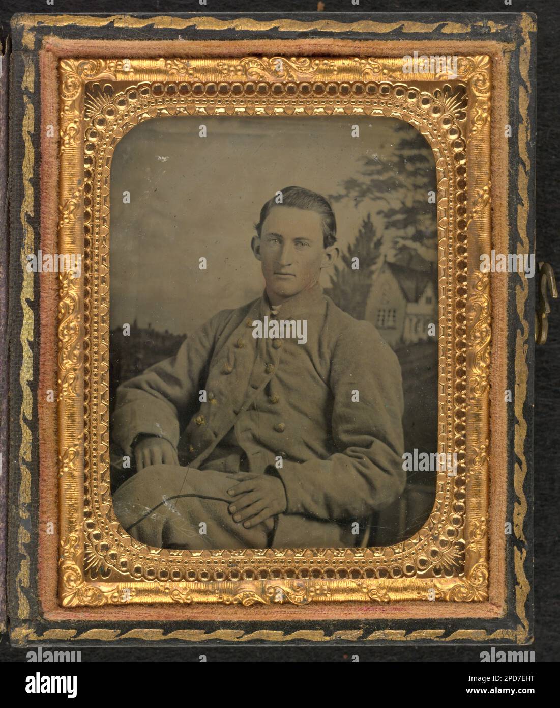 Unidentified soldier in Confederate uniform in front of painted ...
