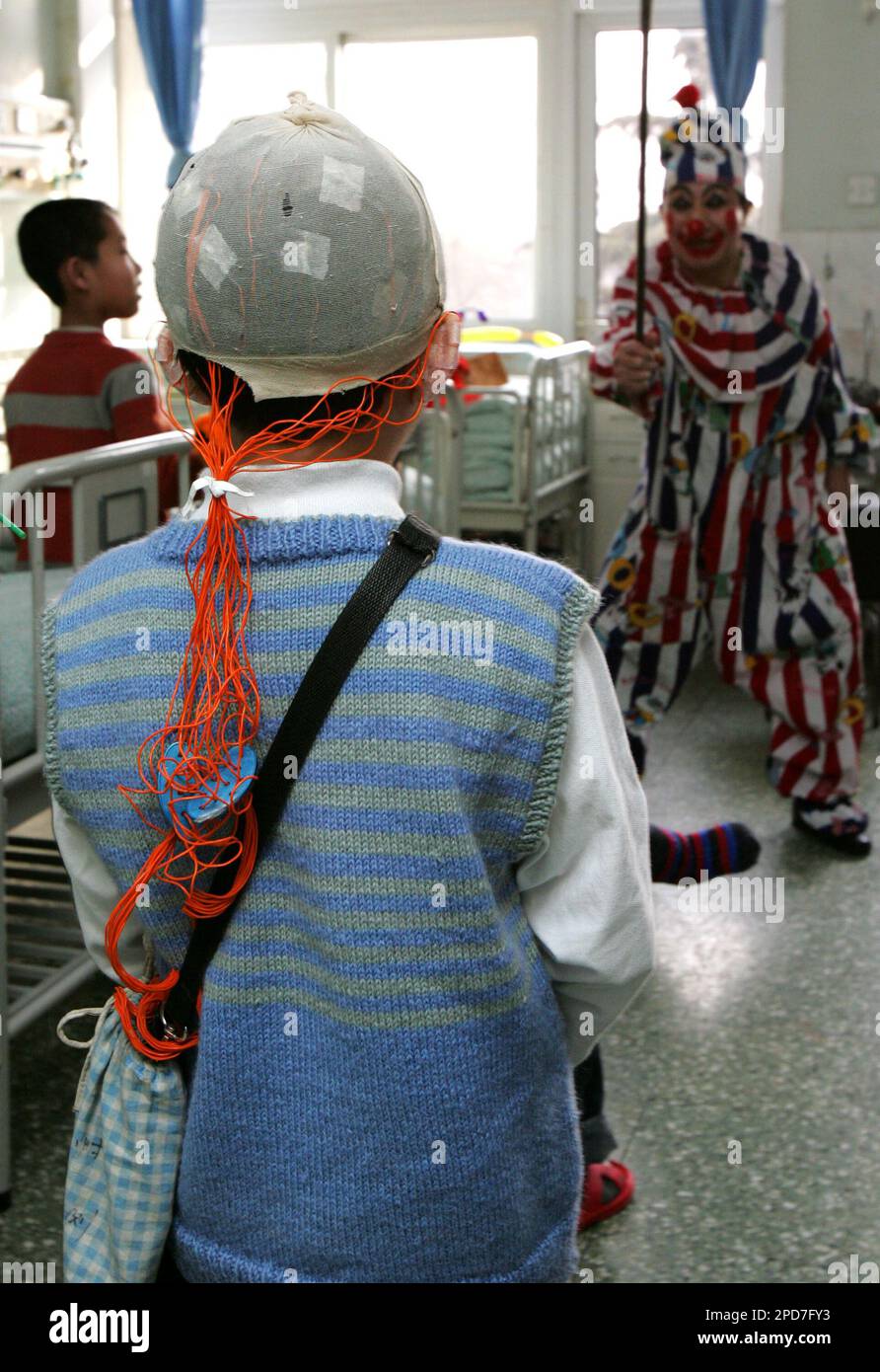 A clown from the organization Magic Hospital entertains children in the ...