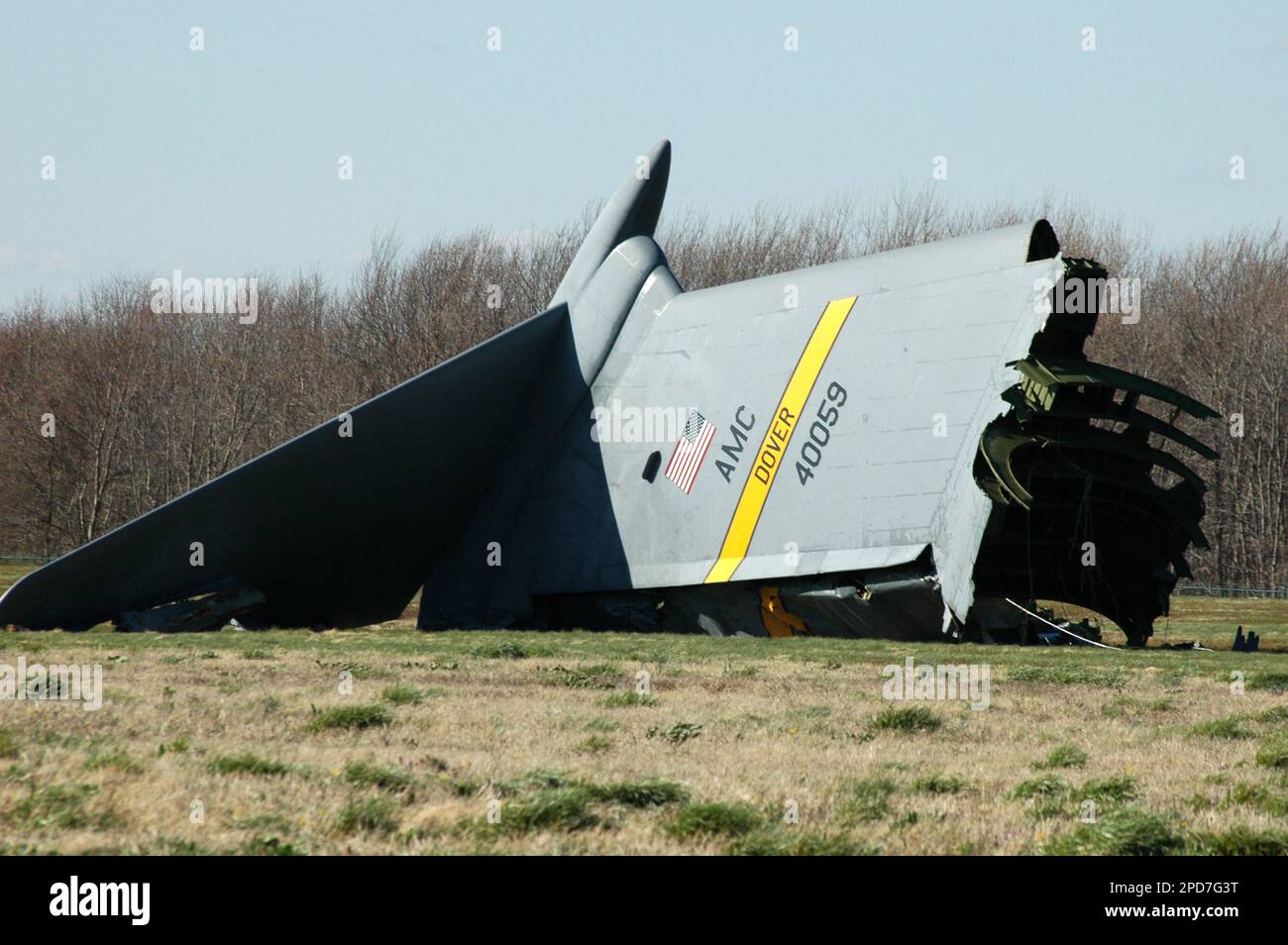 The tail section of a military jet that made a crash landing Monday at ...
