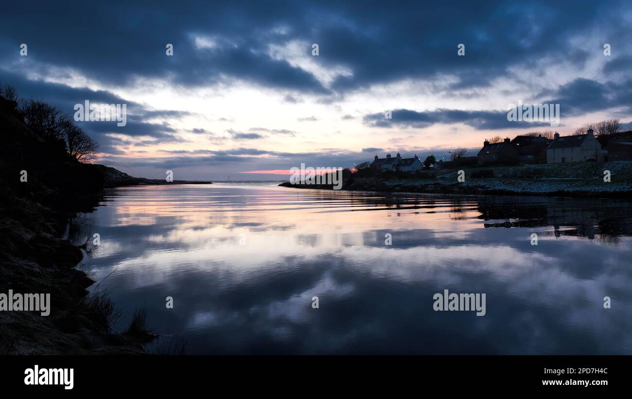 Reflections in the River Brora at sunrise Stock Photo - Alamy