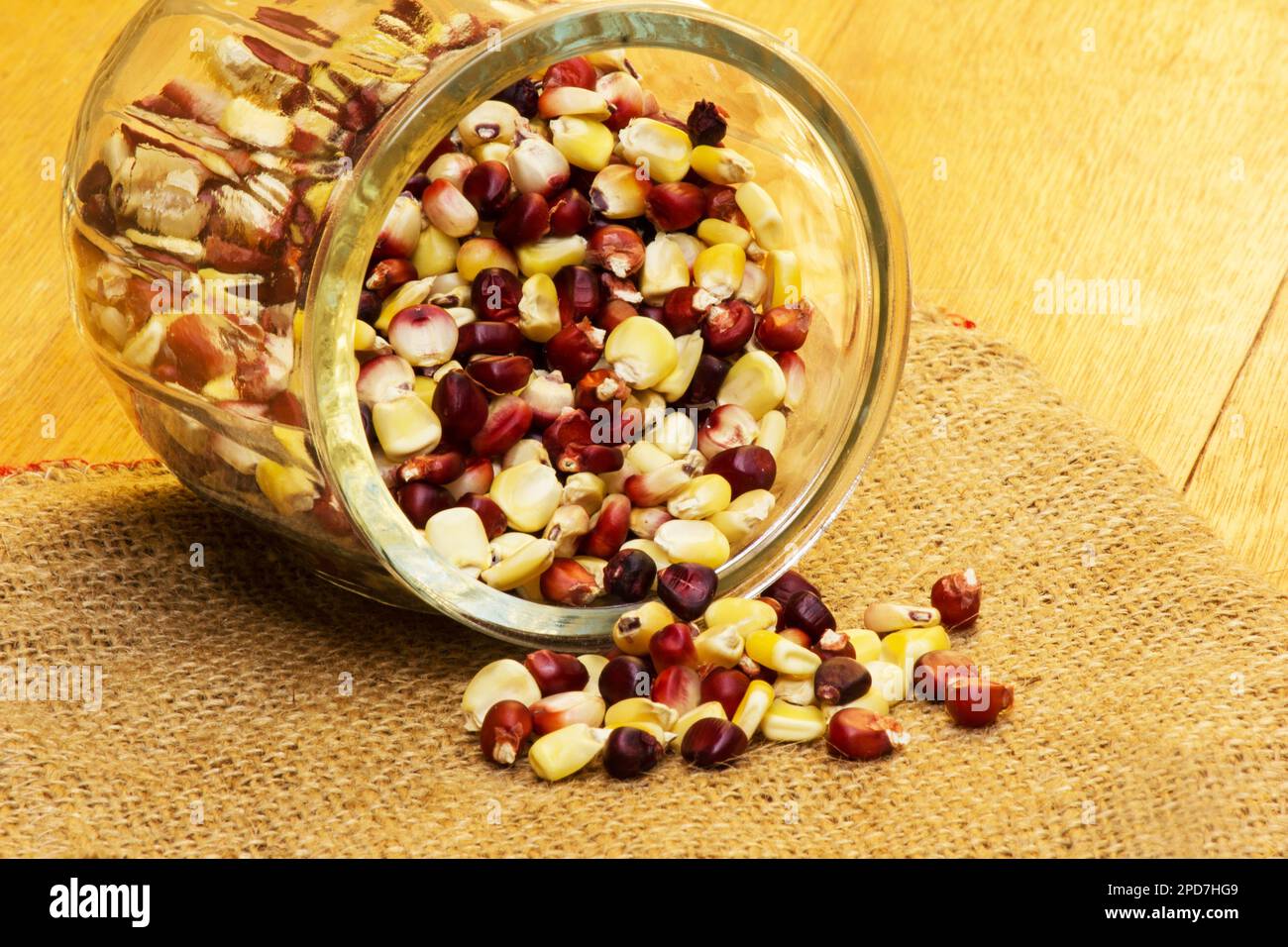 Indian corn kernels on wooden background Stock Photo - Alamy