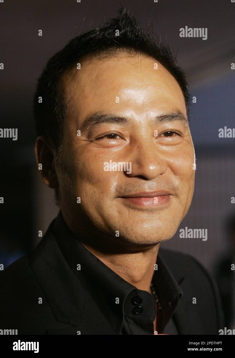 Hong Kong actor Simon Yam smiles during the movie premiere of their new ...