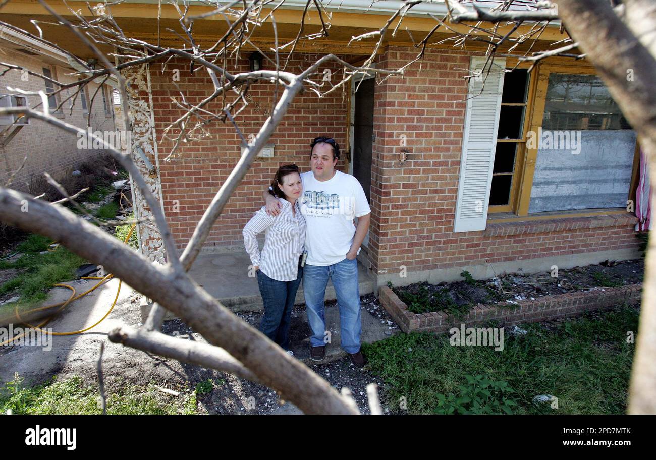 Lisa Sands, left, and her husband Lee Sands stand in front of their ...
