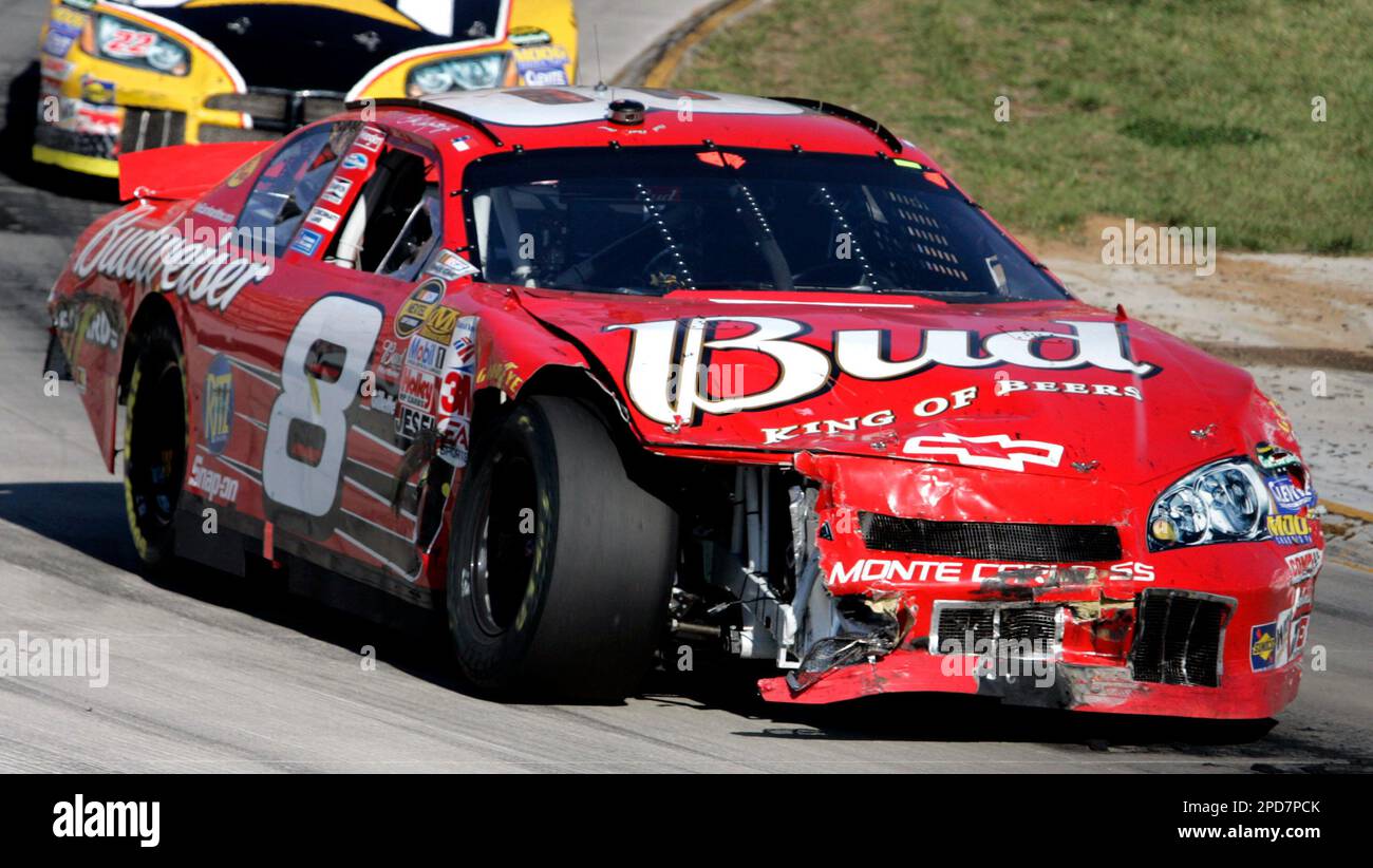 Dale Earnhardt Jr., drives his mangled car around Turn 4 during the ...