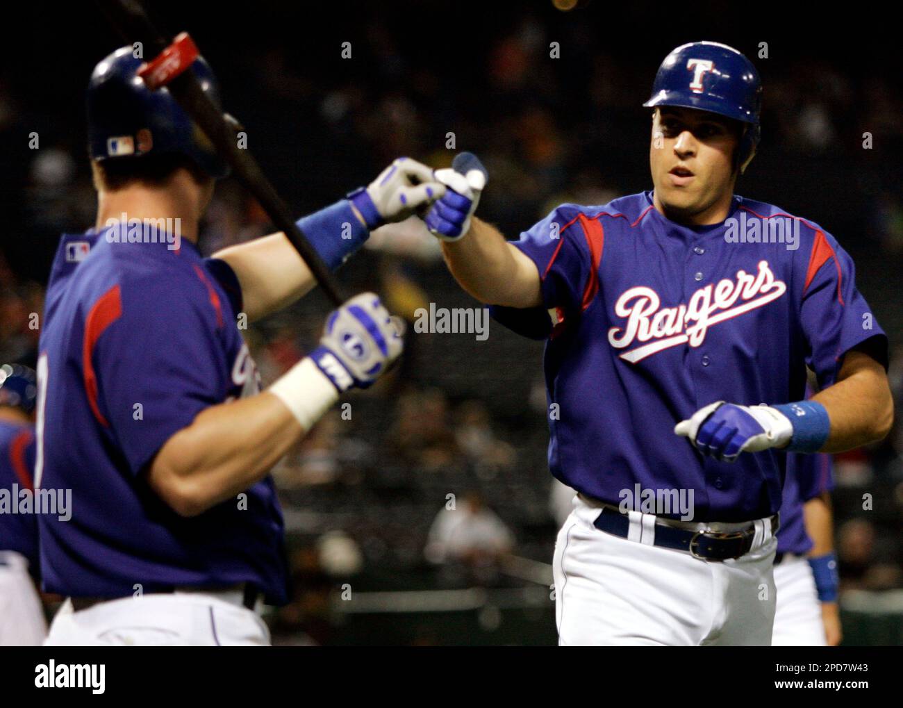 Texas Rangers Hank Blalock, left, congratulates Mark Teixeira, right ...