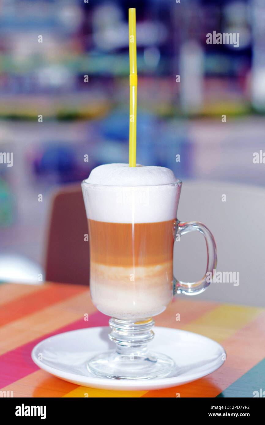 Tall cup of fresh coffee latte with wipped cream Stock Photo - Alamy