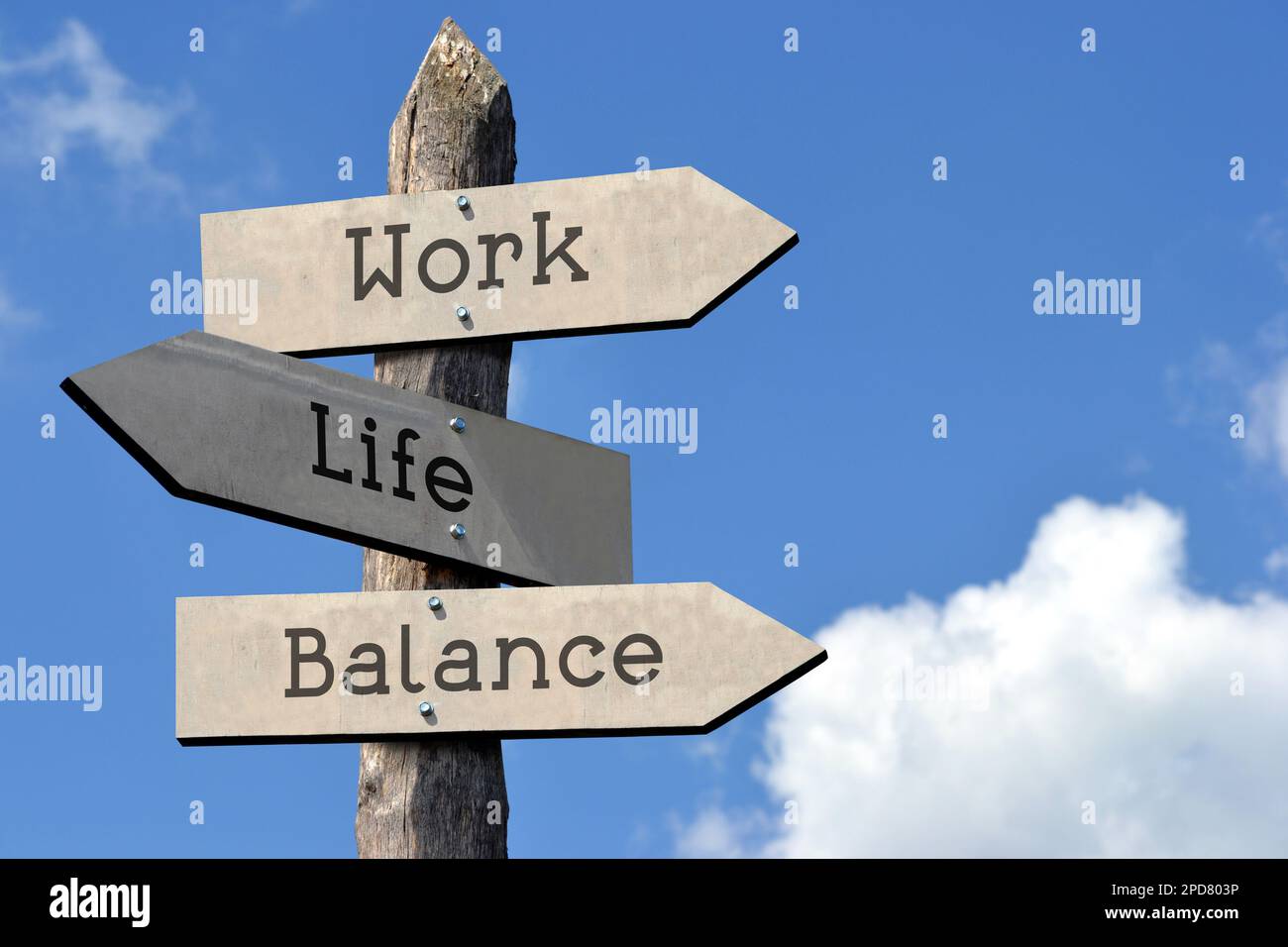 Work, life, balance - wooden signpost with three arrows, sky with ...