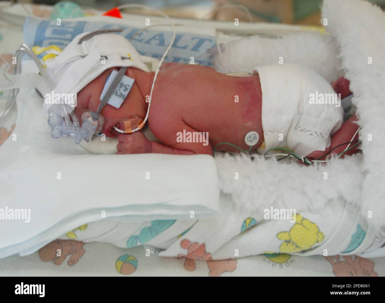 Newborn quintuplet Weston Stevenson rests, Friday, March, 31, 2006, in ...