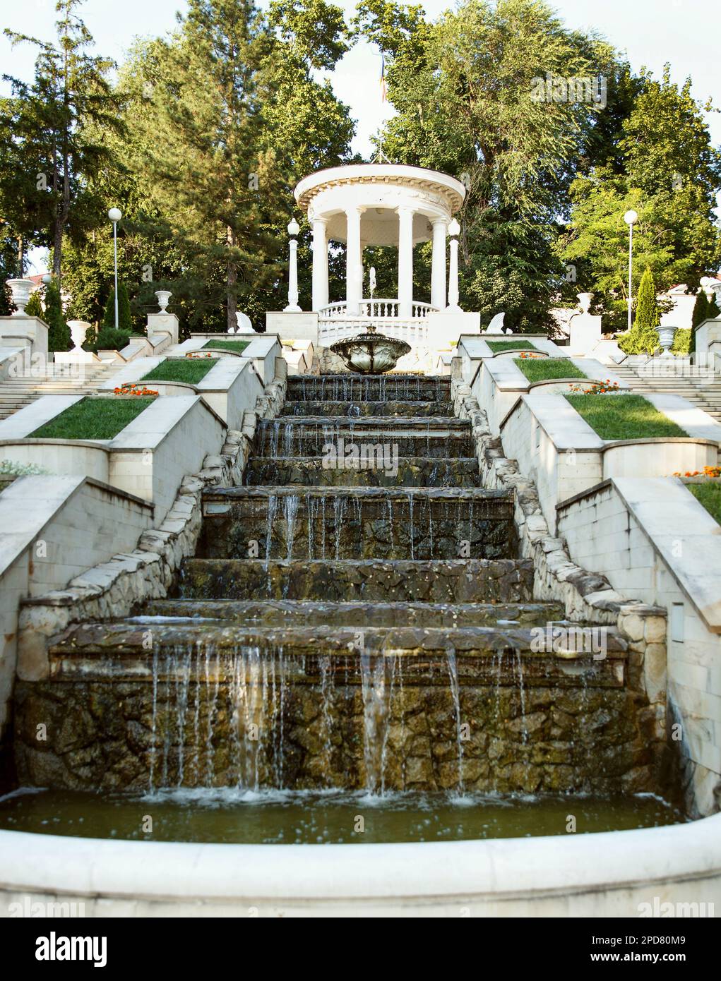Restored rotunda and cascade ladder filled with water in the park ...