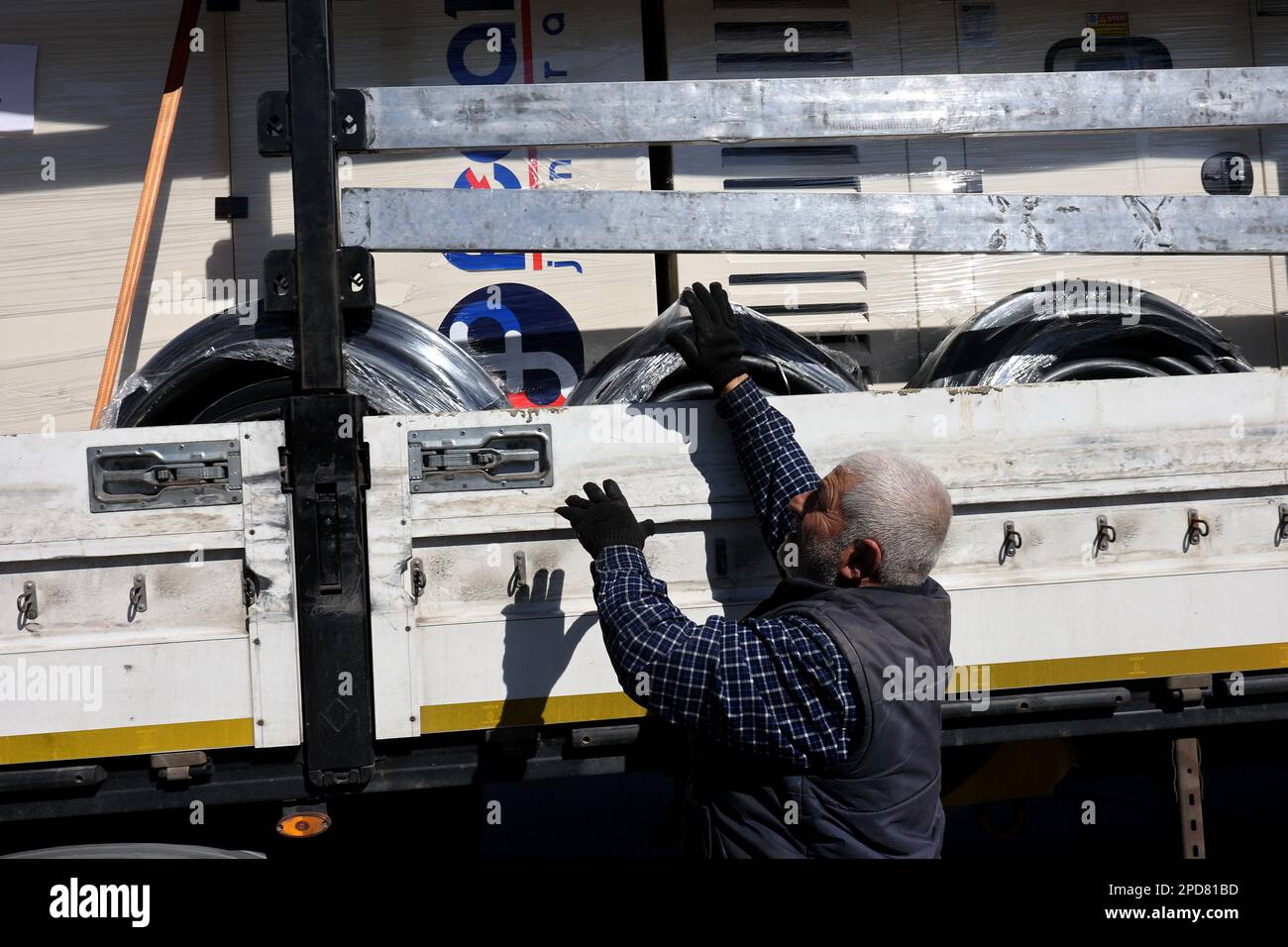 KHARKIV, UKRAINE - MARCH 14, 2023 - A worker partakes in the unloading ...