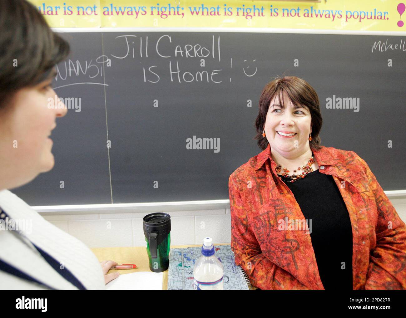 Clague Middle School French teacher Jennifer Quint, left, talks about ...
