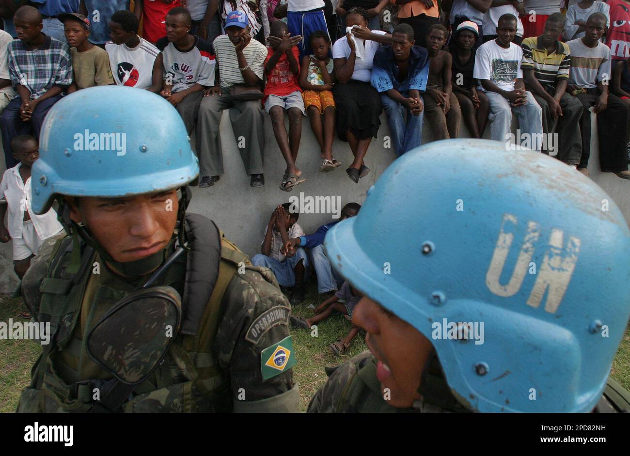 U.N. Brazilian peacekeepers talk as Haitians attend an anniversary ...