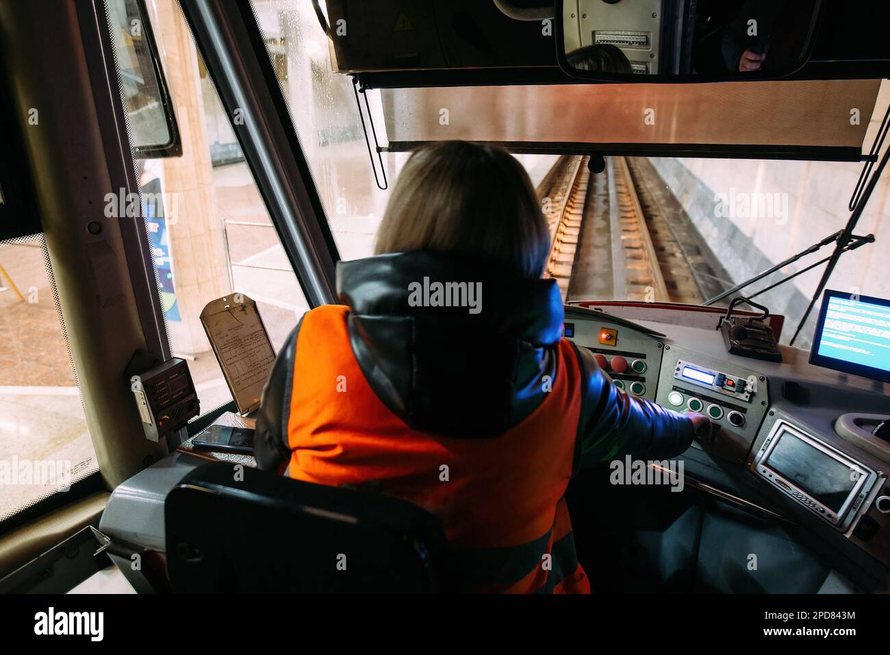 Subway train driver on workplace, view from behind Stock Photo - Alamy
