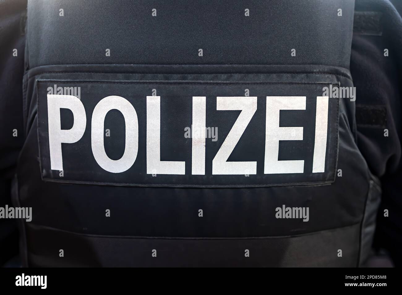 Polizei inscription on german police officer (Polizei means Police in ...