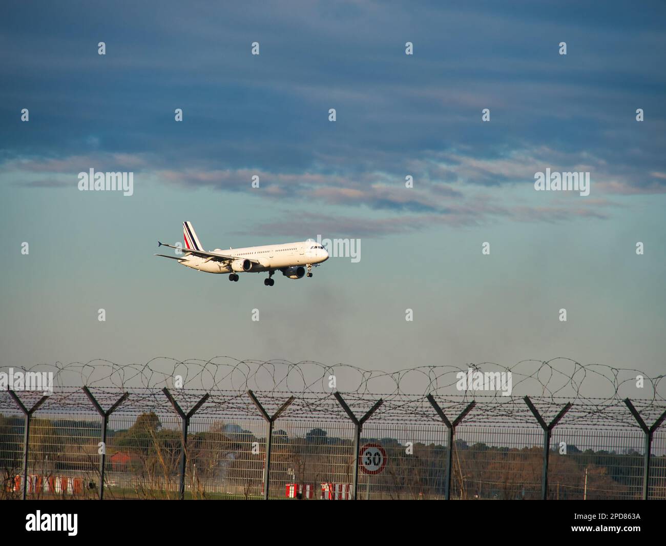 Passenger airplane is landing in runway. Protected area of ...