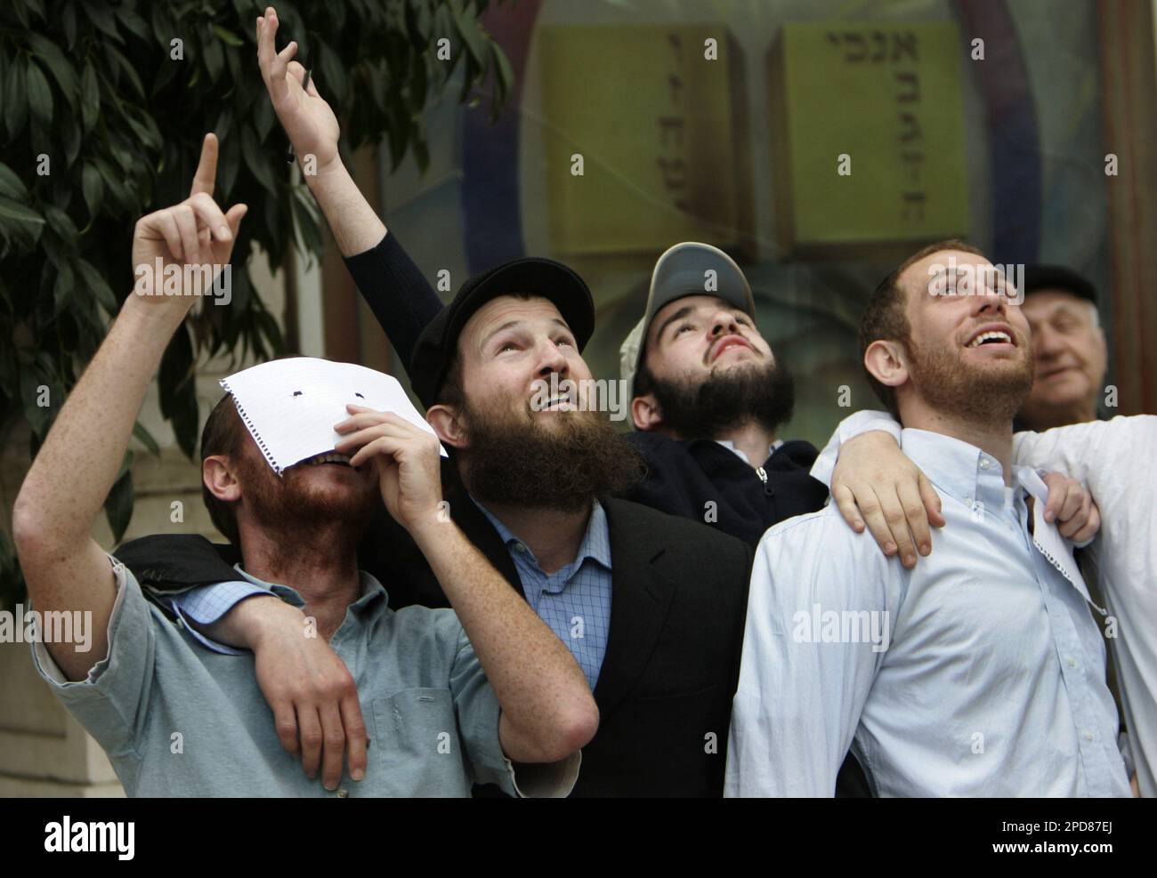 Orthodox Jewish student of a yeshiva religious school watch as the moon ...