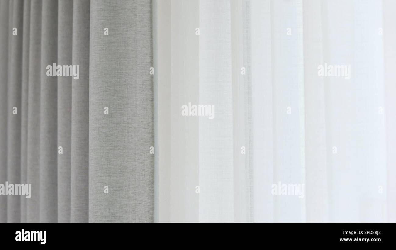 Voile curtain in front of window with grey curtain to side Stock Photo ...