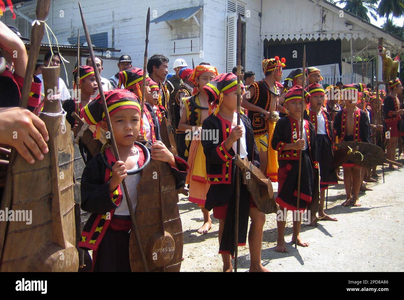 Children of Nias island prepare to perform a traditional war dance ...