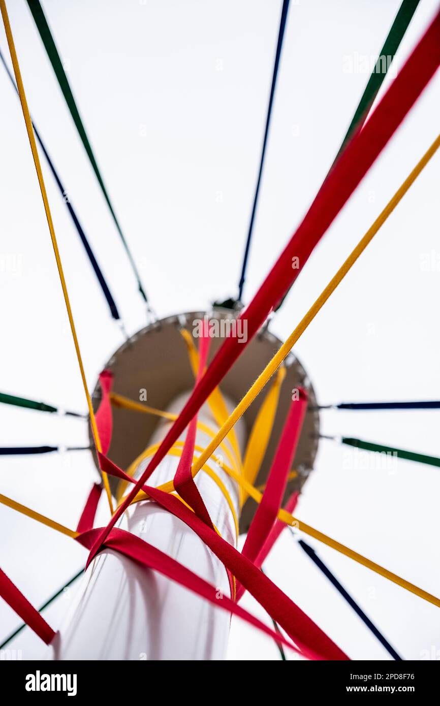 Brightly coloured ribbons of a traditional English maypole used for ...