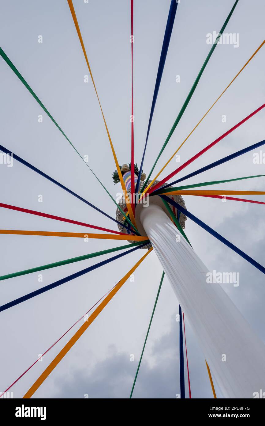 Brightly coloured ribbons of a traditional English maypole used for ...