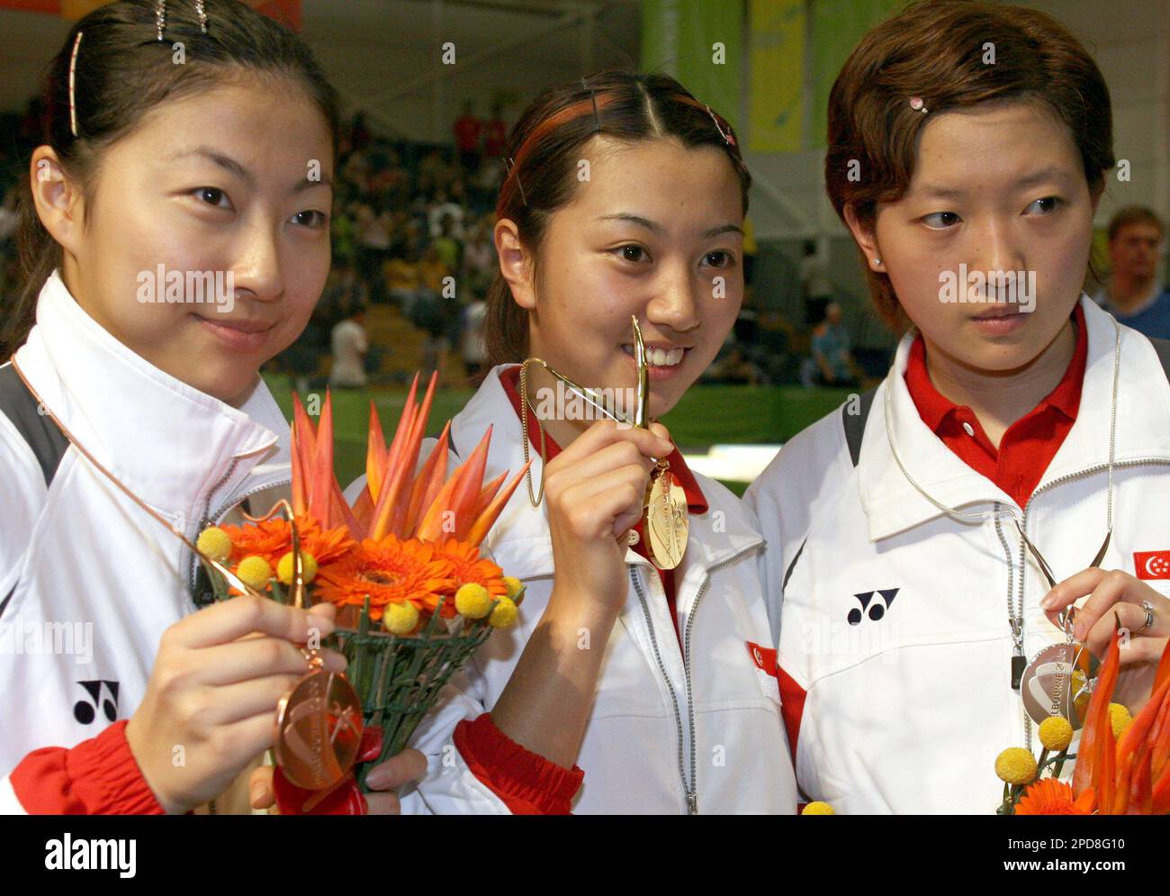 Singapore's gold medal winner Zhang Zue Ling, center, and her ...
