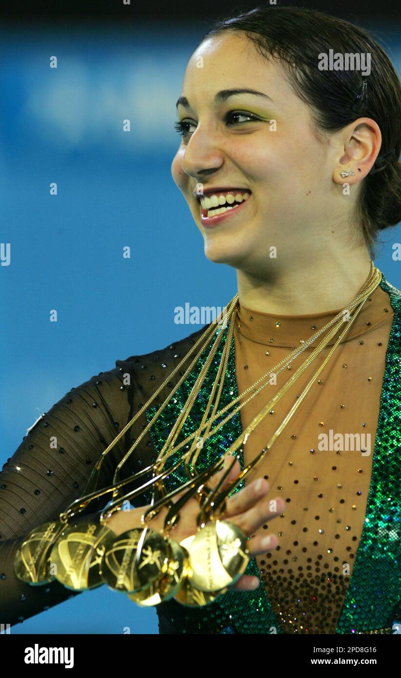 Canadian Alexandra Michel Orlando smiles with her five gold medals she ...