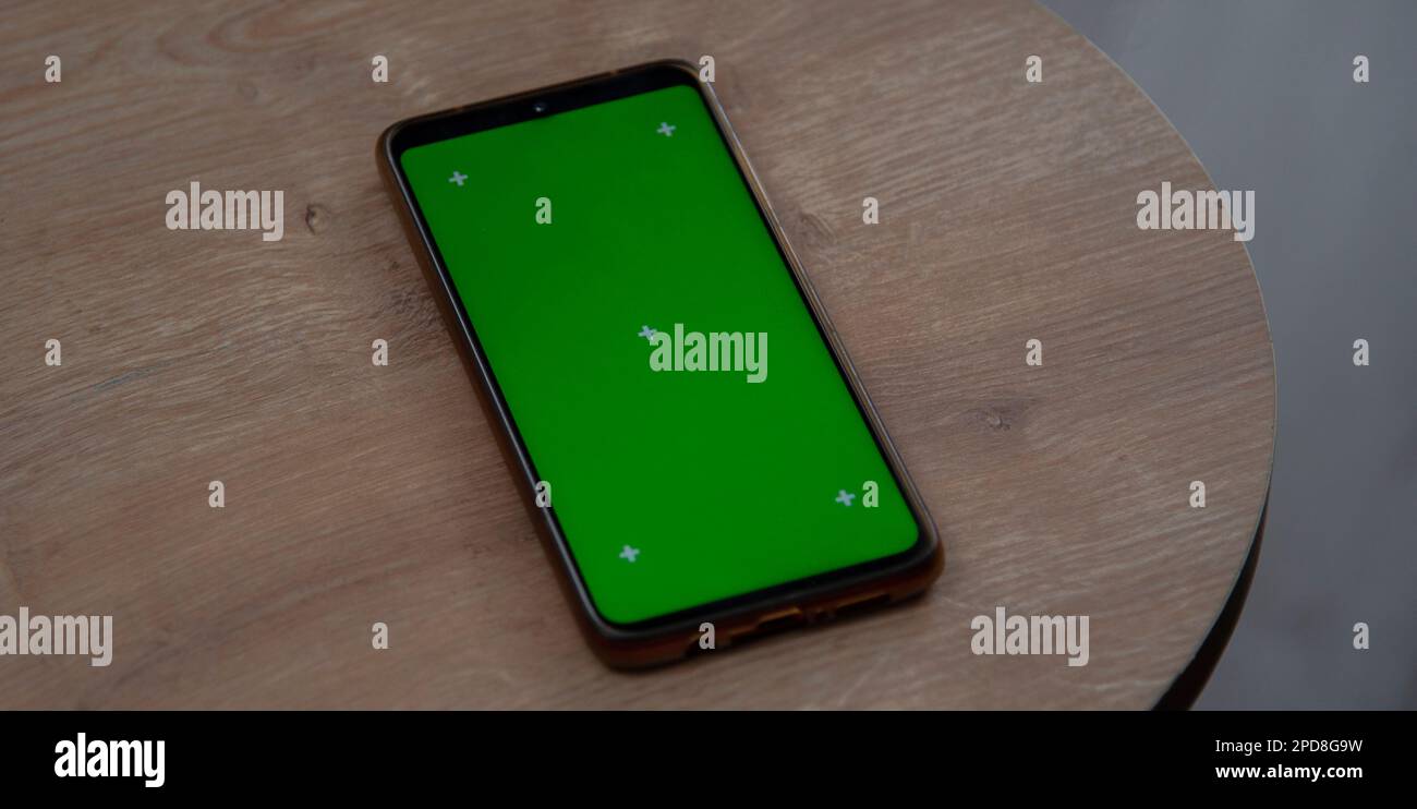 Smartphone with Green Chroma Key Screen Stock Photo - Alamy