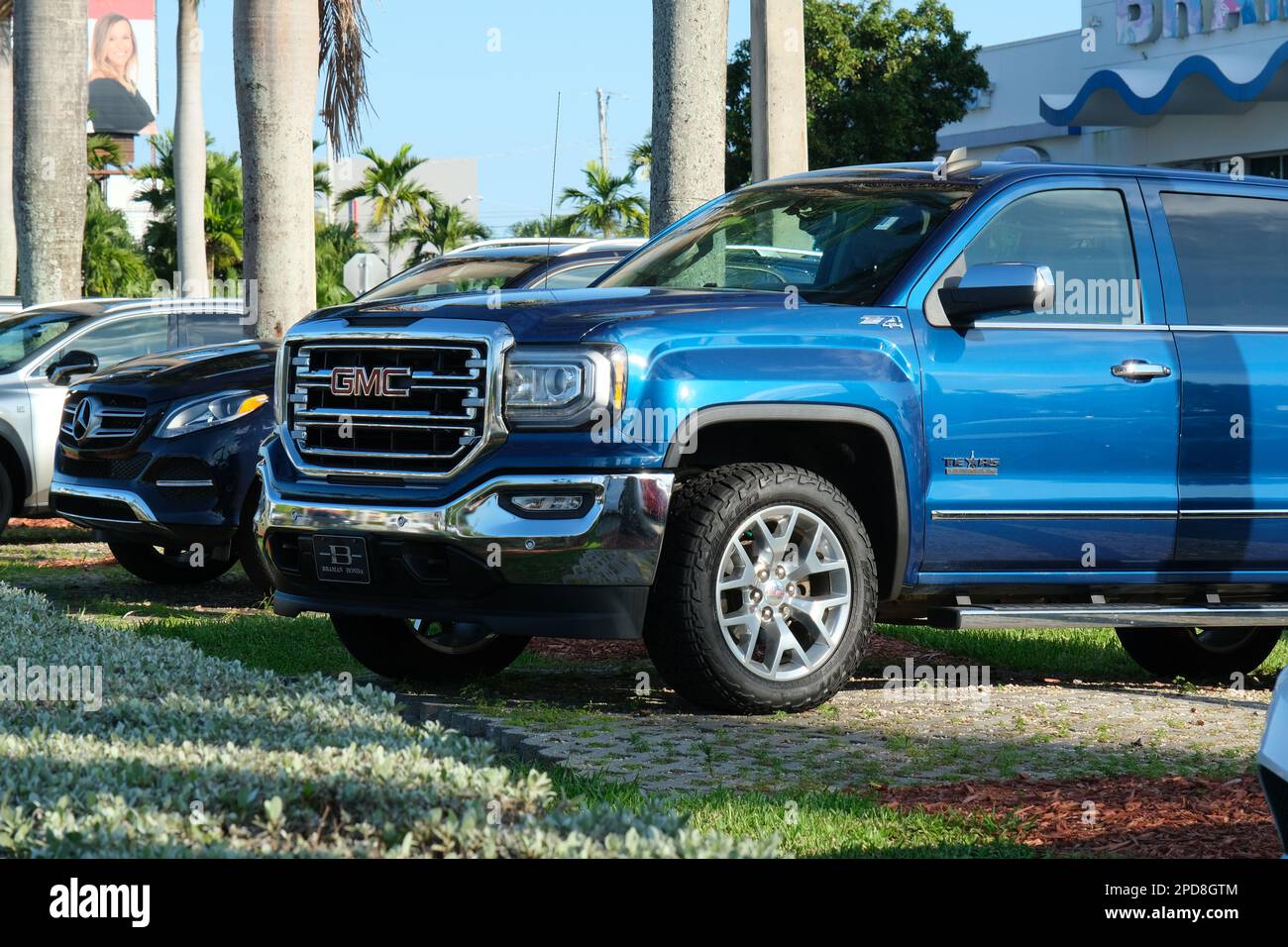 Brand new GMC blue truck parked in the front of a dealership Stock ...