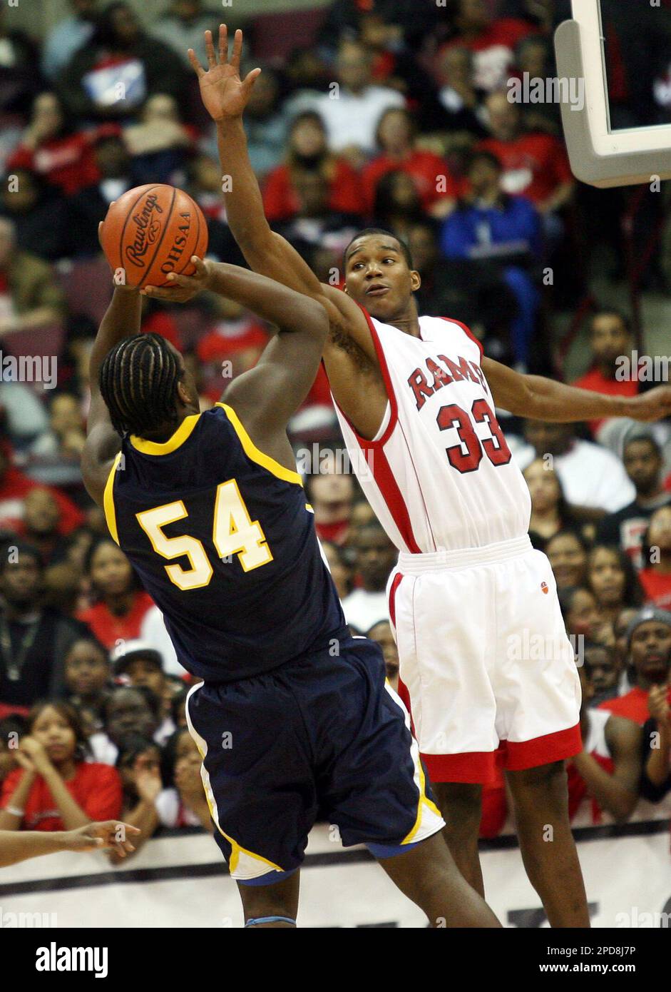 Lancaster's Brett McKnight (54) shoots over Trotwood Madison's Chris ...