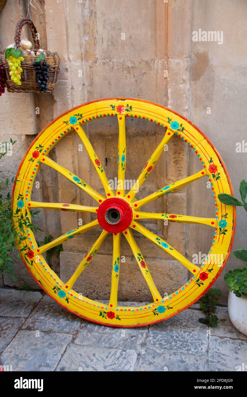 yellow wheel of a sicilian traditional decotated cart at Ragusa Stock ...