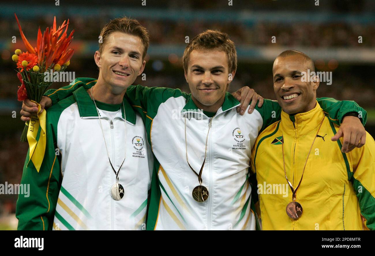 South Africa's Louis Van Zyl, center, the gold medal winner and his ...