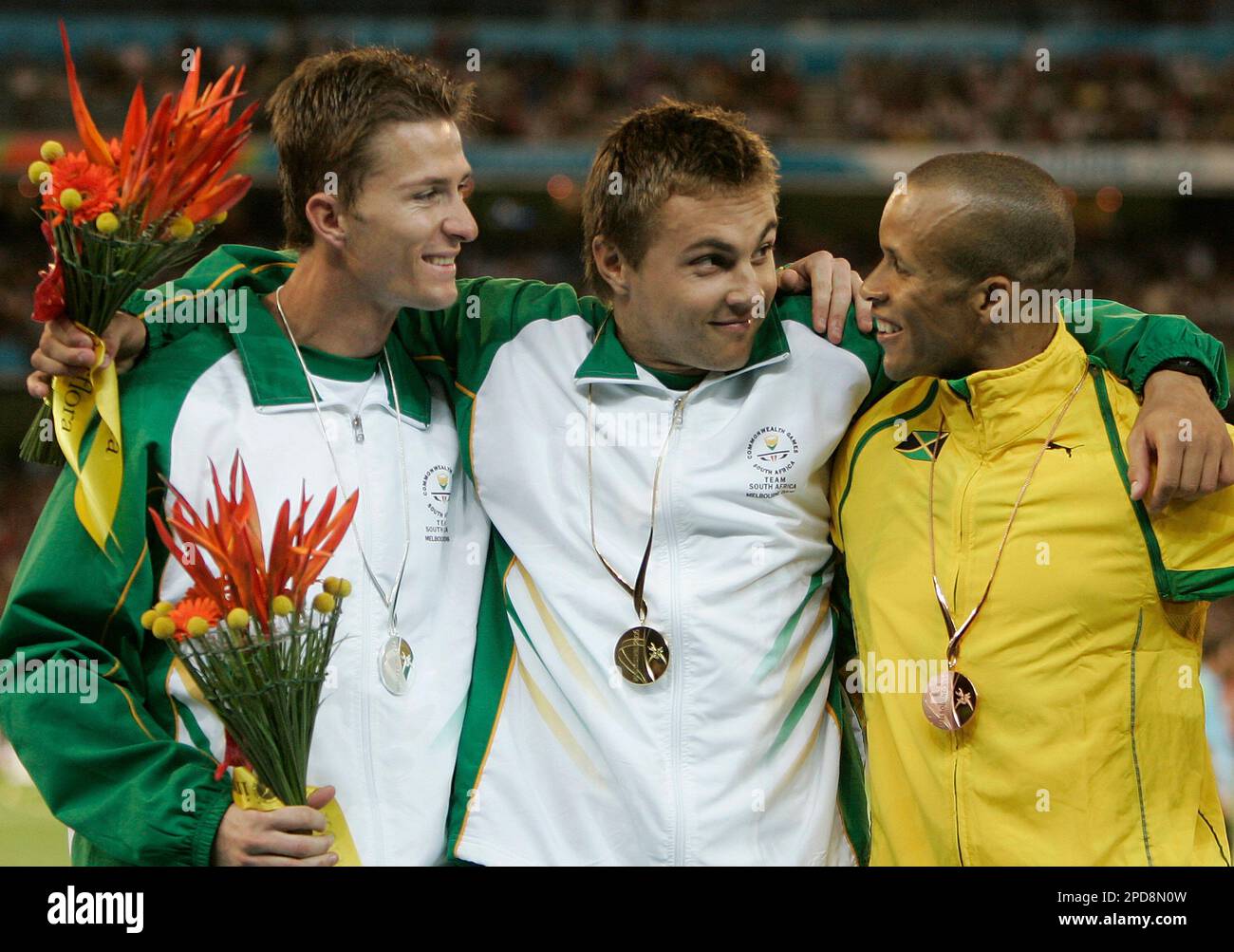 South Africa's Louis Van Zyl, center, the gold medal winner and his ...