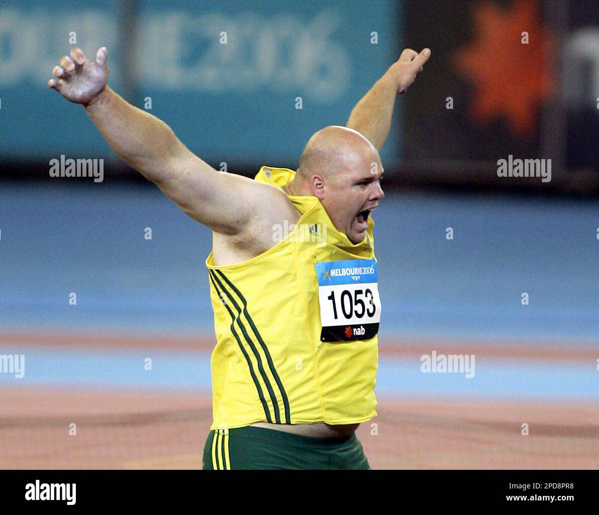 Australia's Scott Martin celebrates after making his final throw to win ...