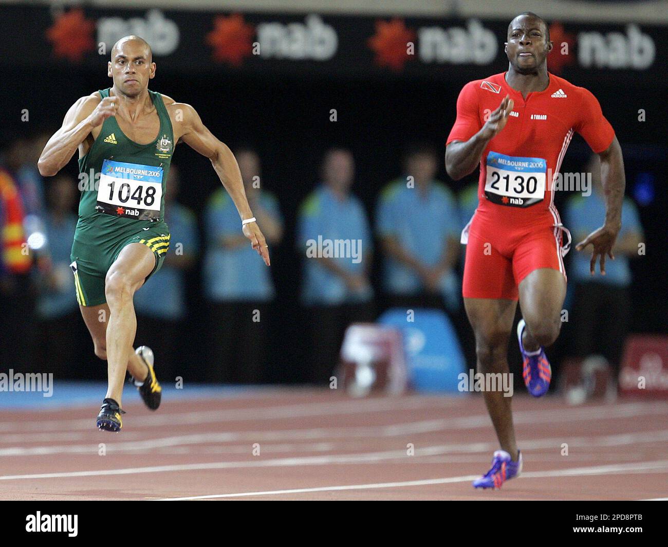 Australia's Patrick Johnson, left, and Kevon Pierre of Trinidad and Tobago race in a Men's 200 ...