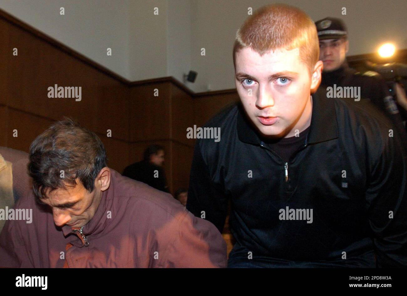 British soccer fan Michael Shields, right, is escorted inside Bulgaria ...