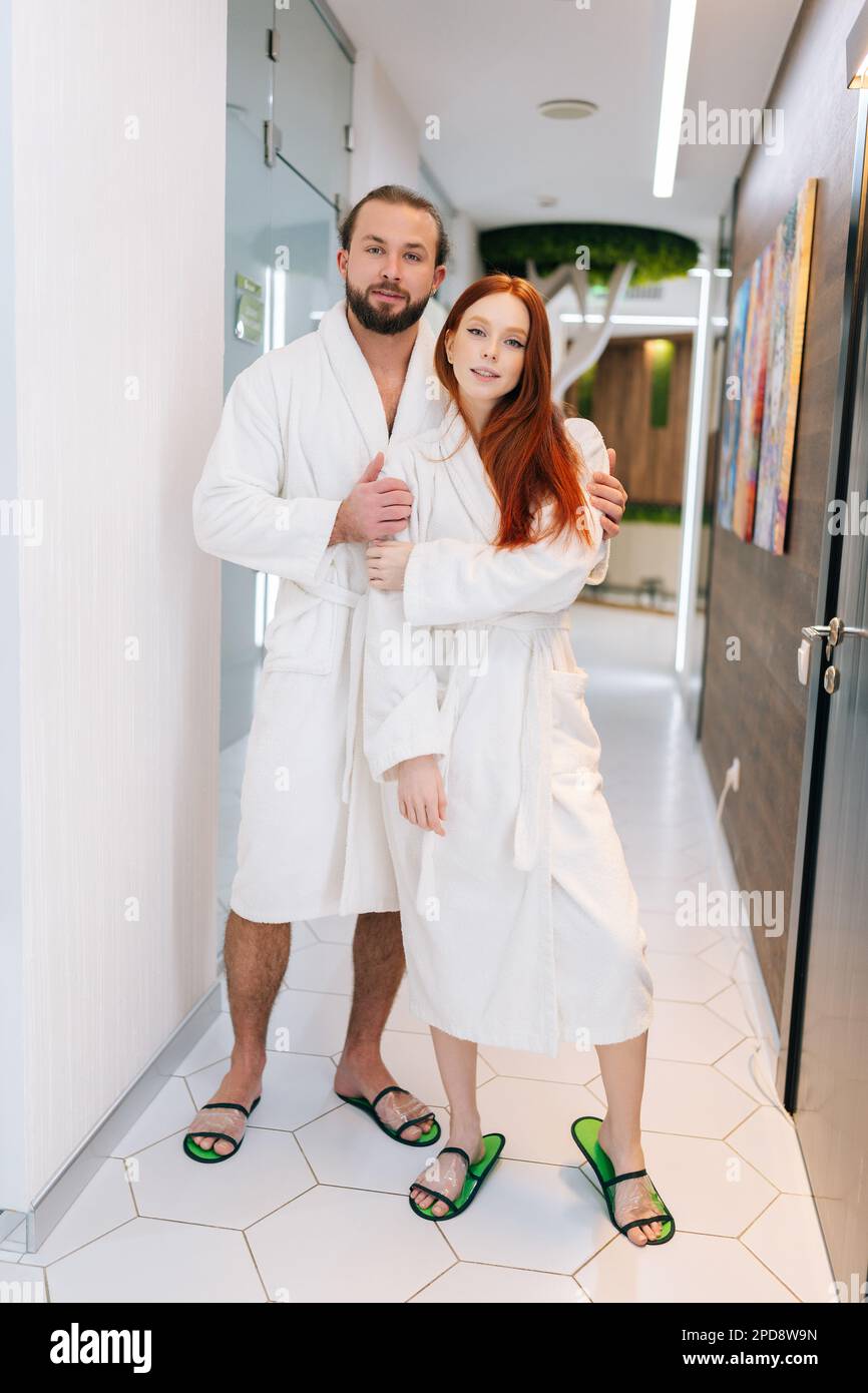 Vertical full length portrait of happy young couple in love wearing ...