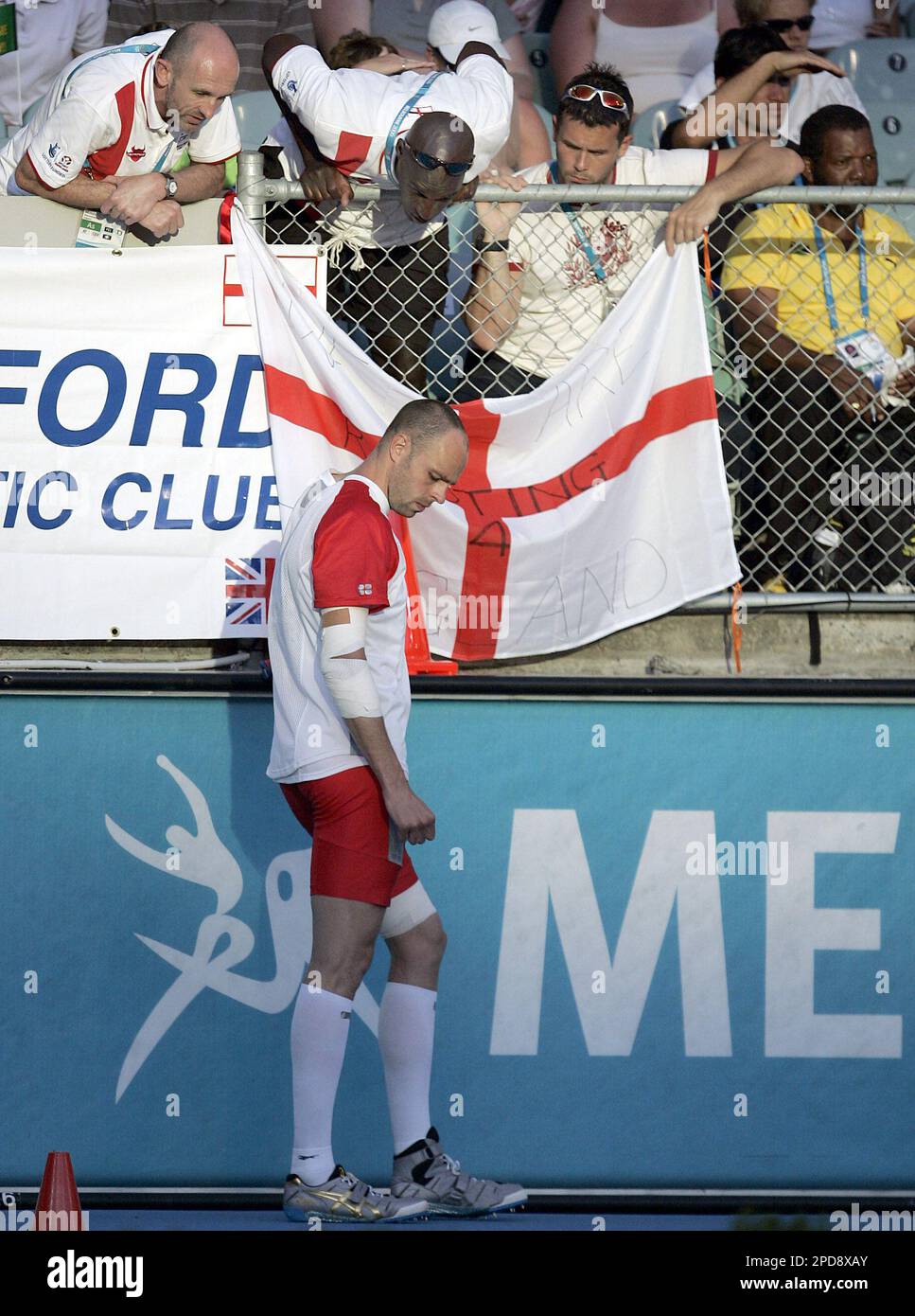 England's Dean Macey receives instructions from members of the crowd ...