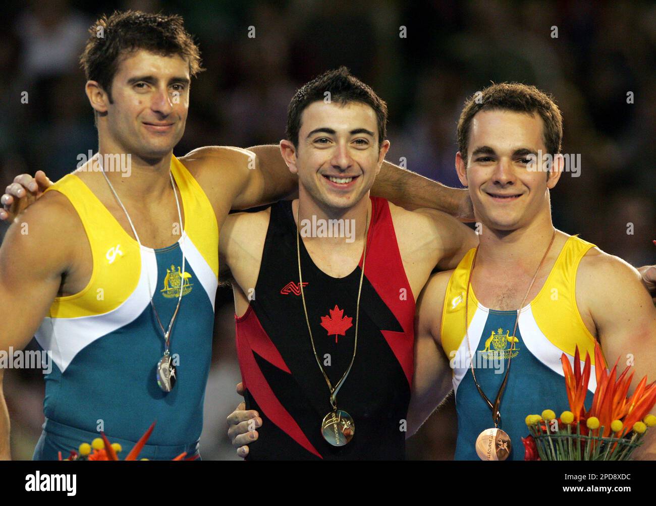 Canadian gold medalist Grant Golding, center poses with Australian ...