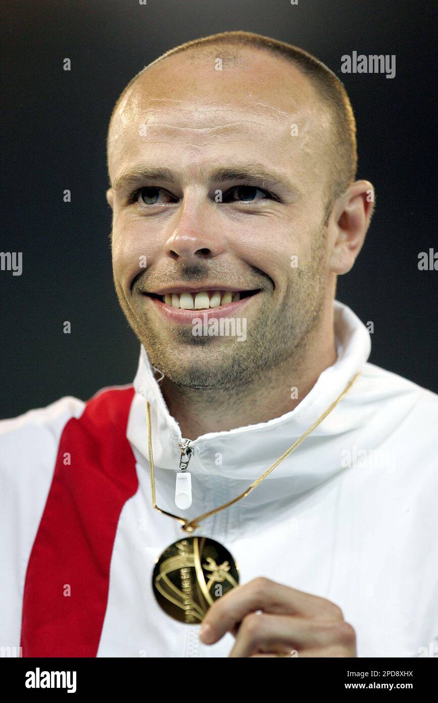 England's Dean Macey, the gold medalist, during the medal ceremony for ...