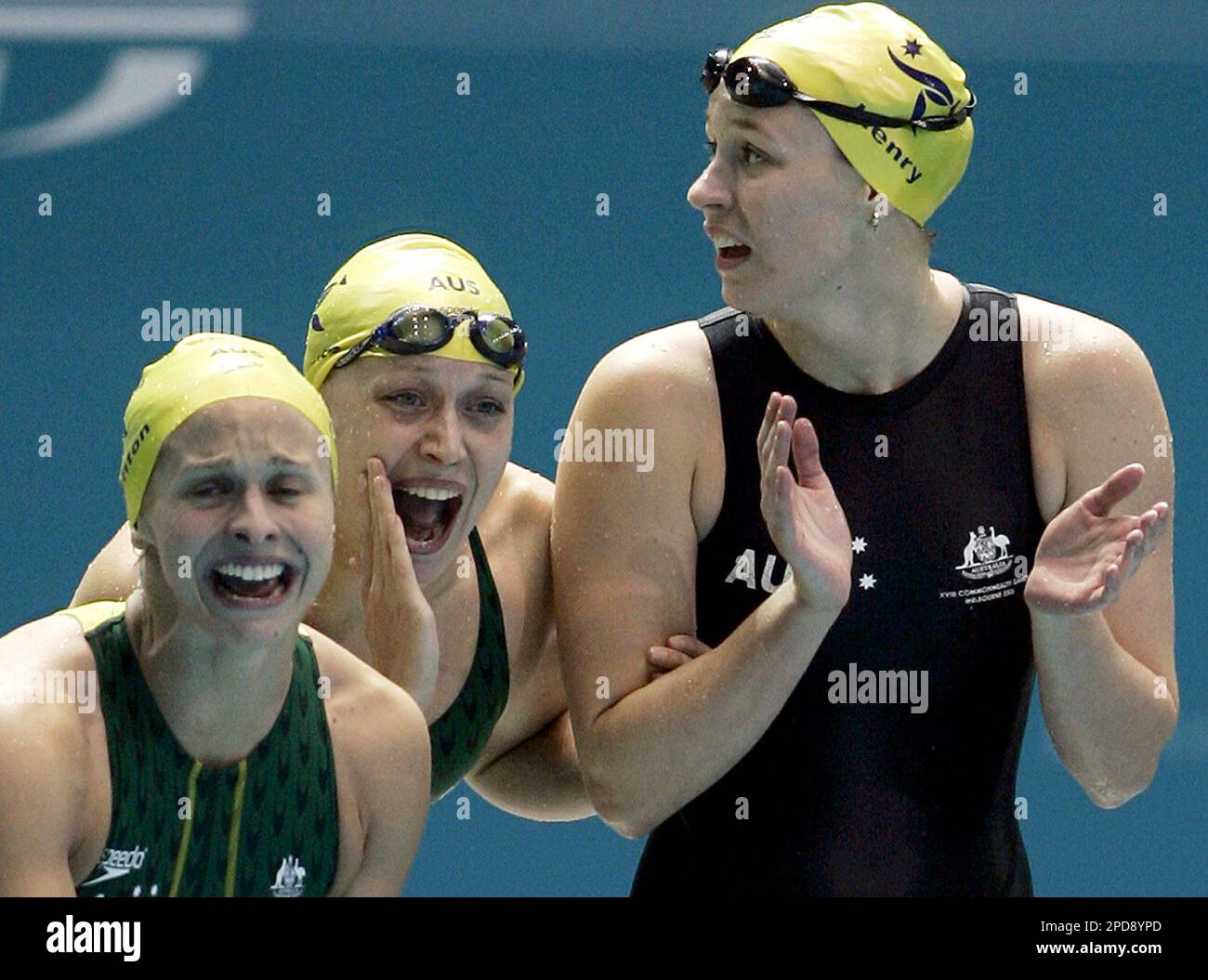 Australia's Libby Lenton, left, and Alice Mills, center, cheers on ...