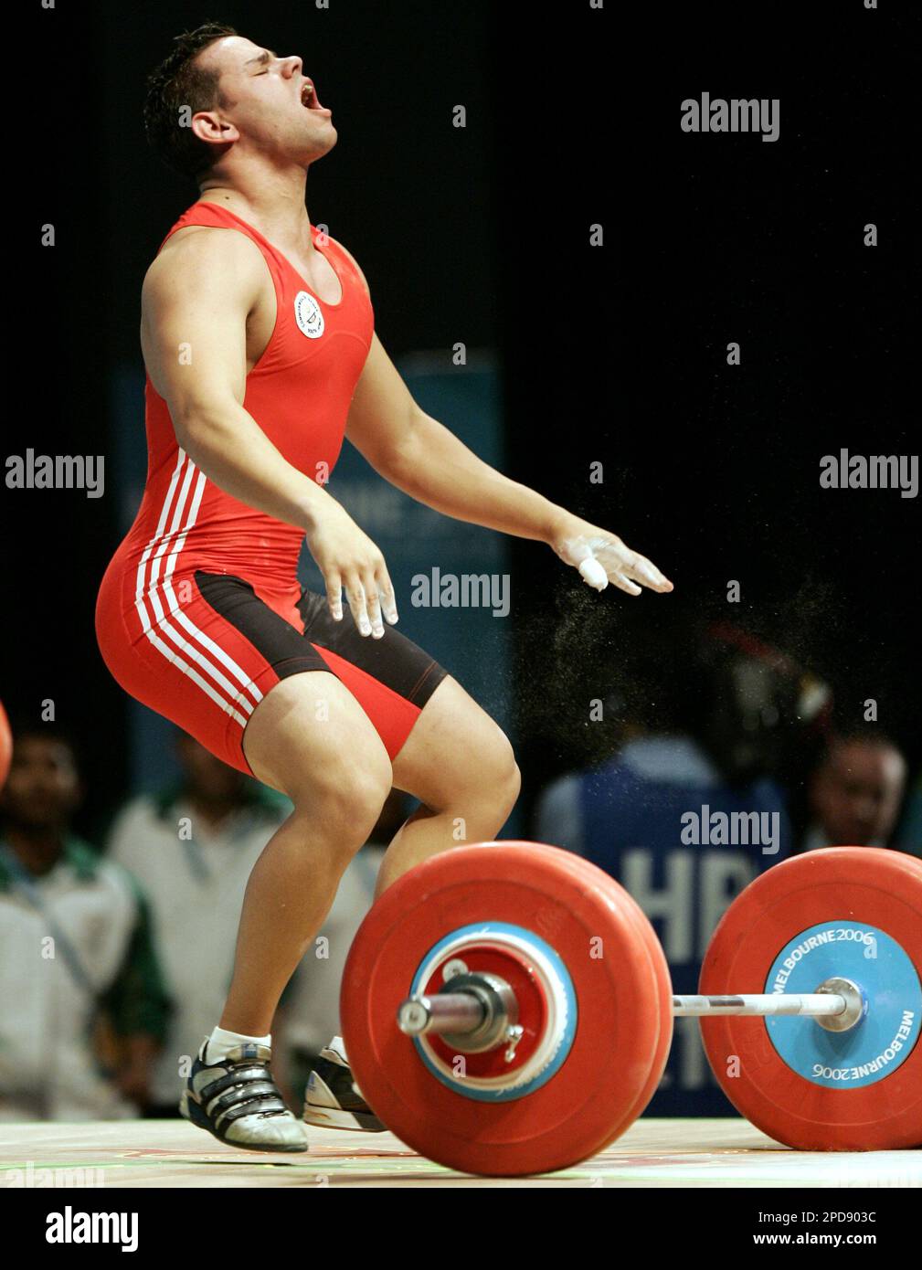 South Africa's Darryn David Anthony grimaces afrer dropping weights ...