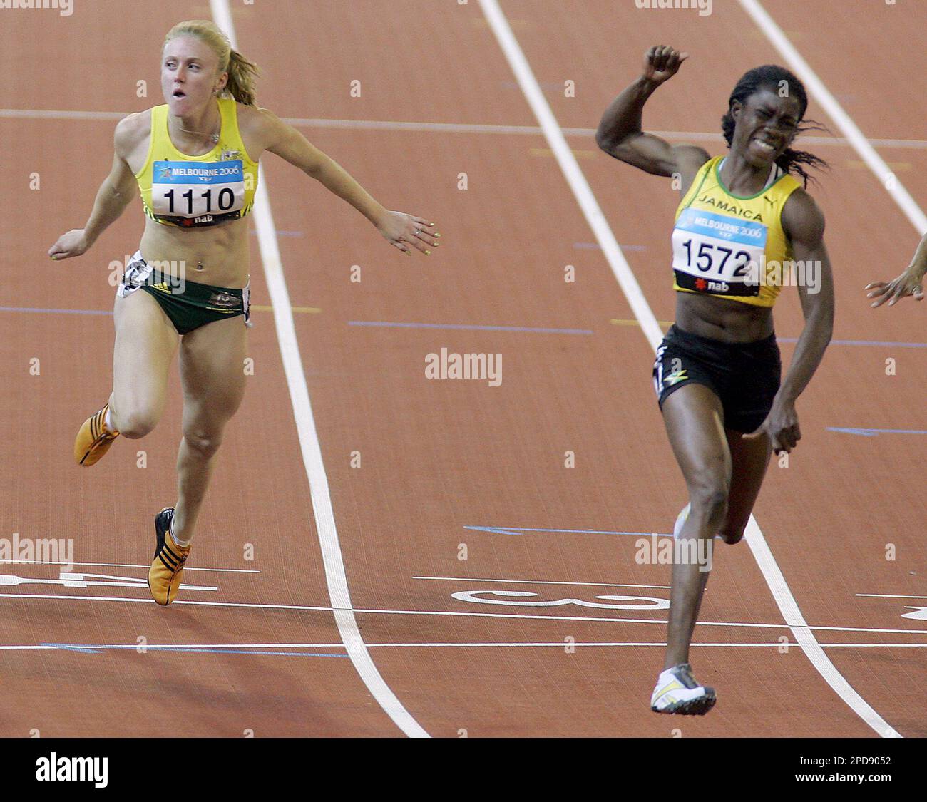 Jamaica's Sheri-Ann Brooks, right, celebrates after winning the gold ...