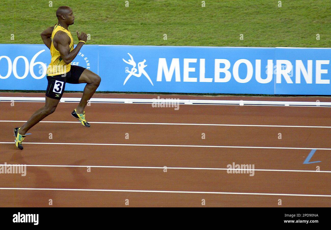 Asafa Powell of Jamaica races to the line alone to win the gold medal ...