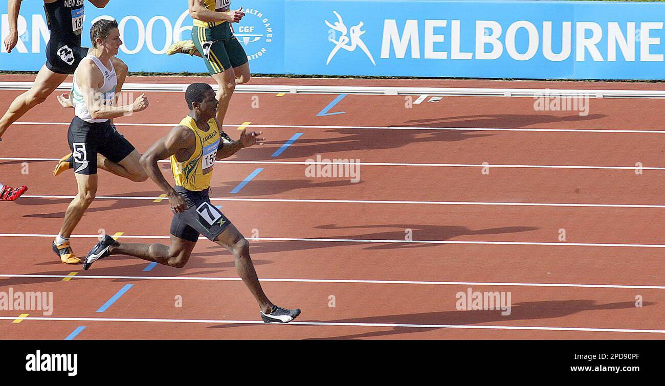 Maurice Smith of Jamaica races to the line ahead of Guernsey's Dale ...