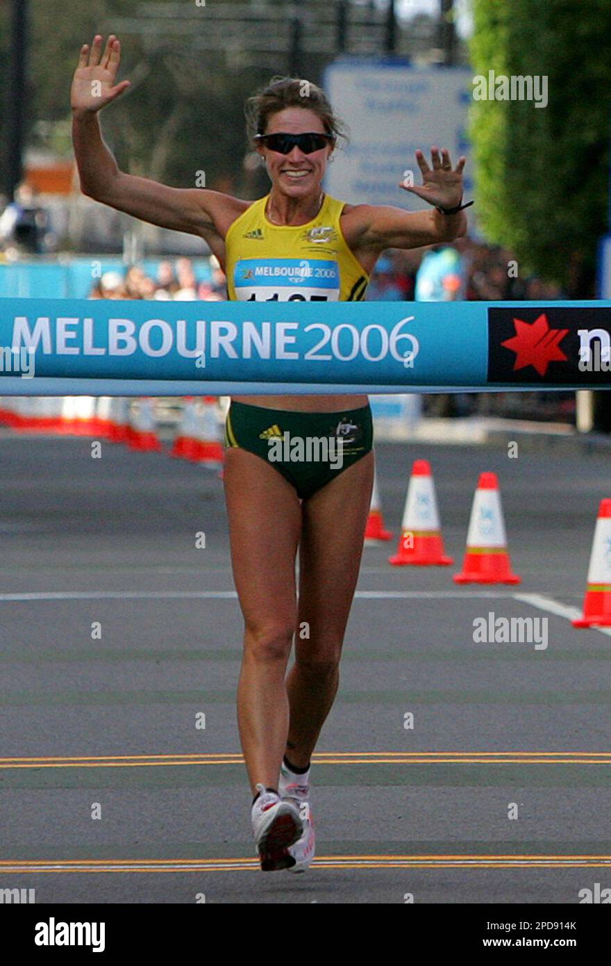 Australia's Jane Saville crosses the finish line to win the ...