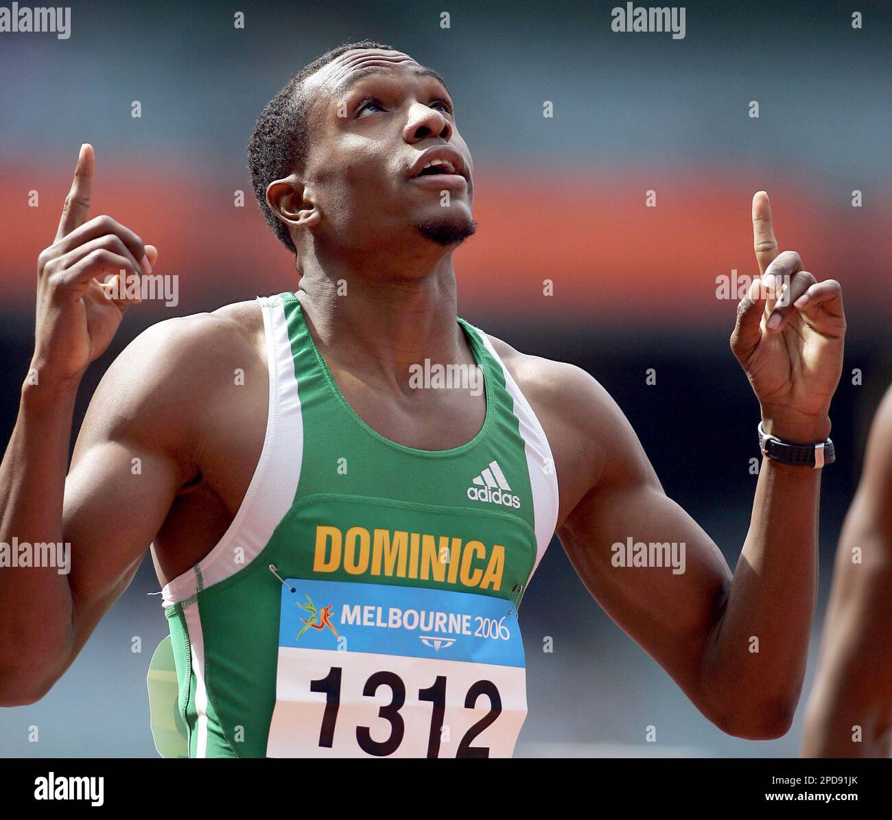 Chris Lloyd of Dominica reacts after finishing a 1st round heat of the ...