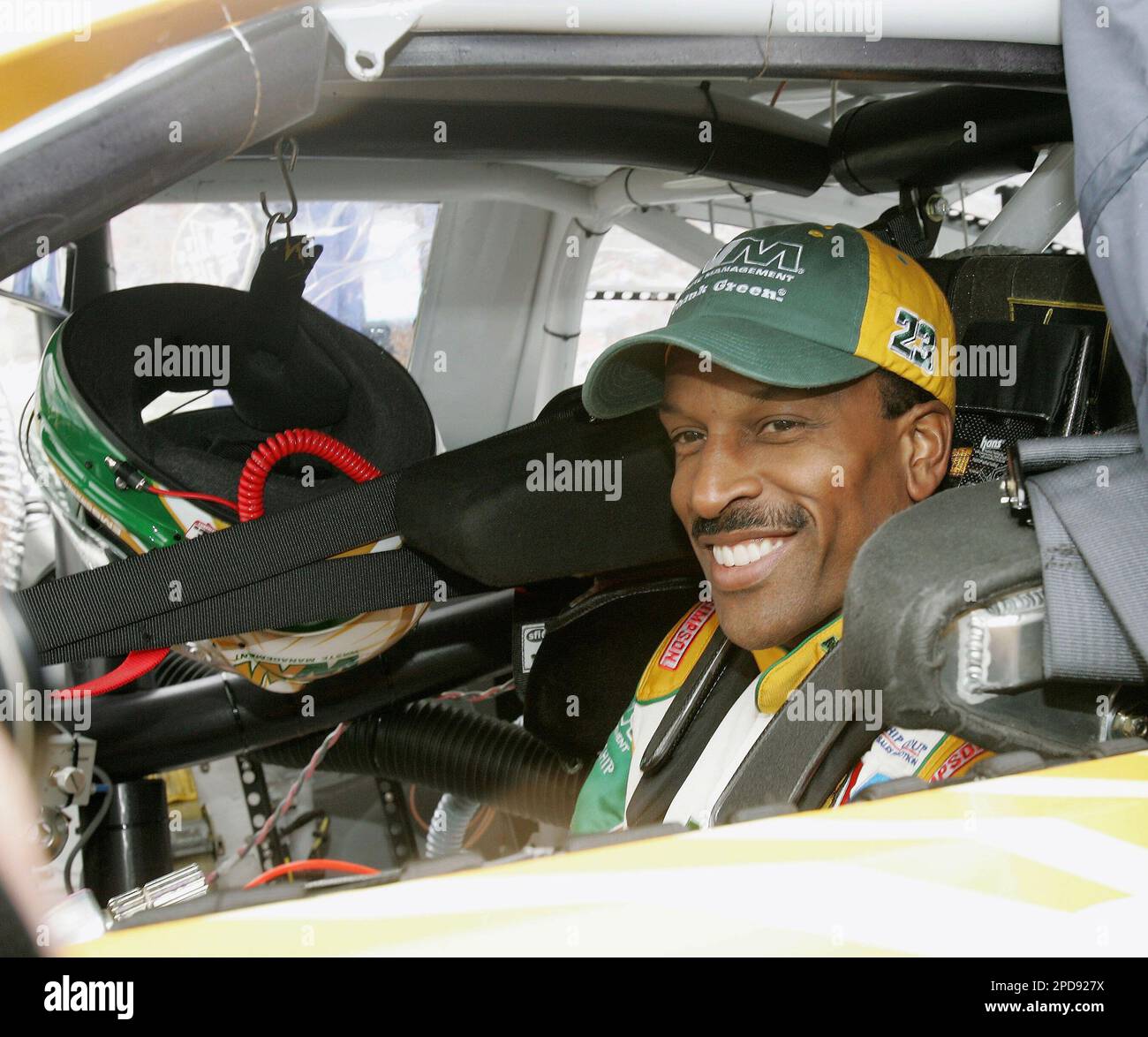 NASCAR driver Bill Lester smiles as he has his photo taked from his ...