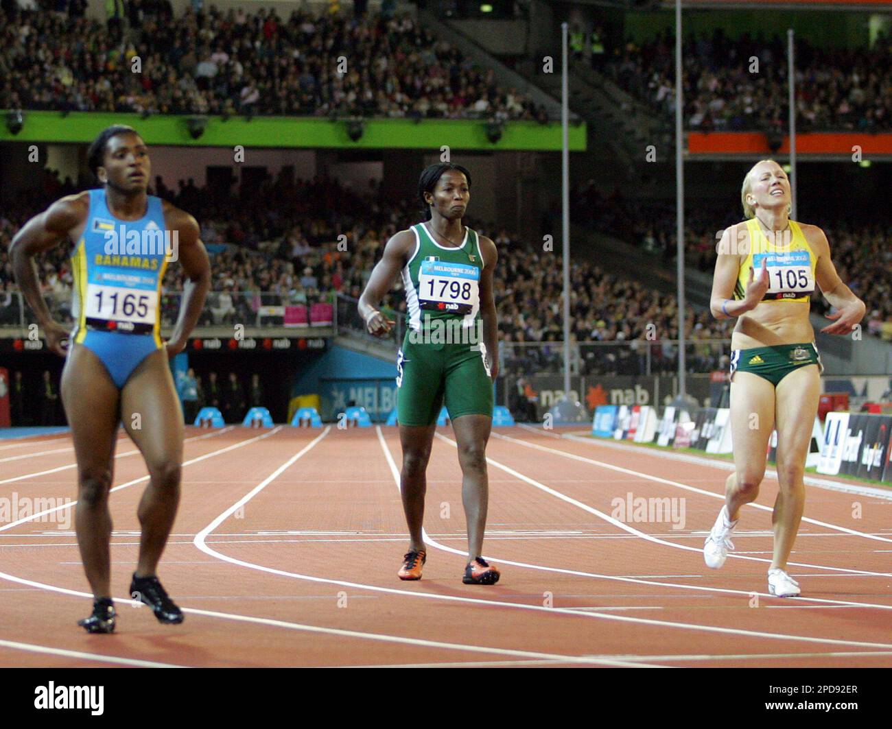 Australia's Tamsyn Lewis, right, reacts after finishing a Women's 400m ...