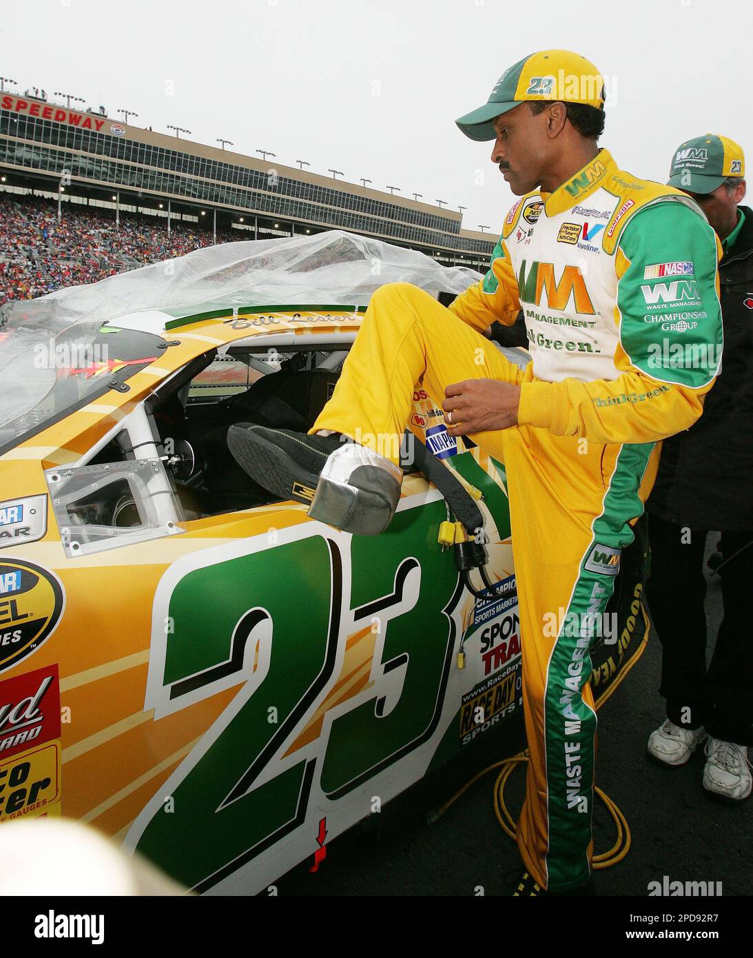 NASCAR driver Bill Lester climbs into his #23 Waste Management Dodge ...